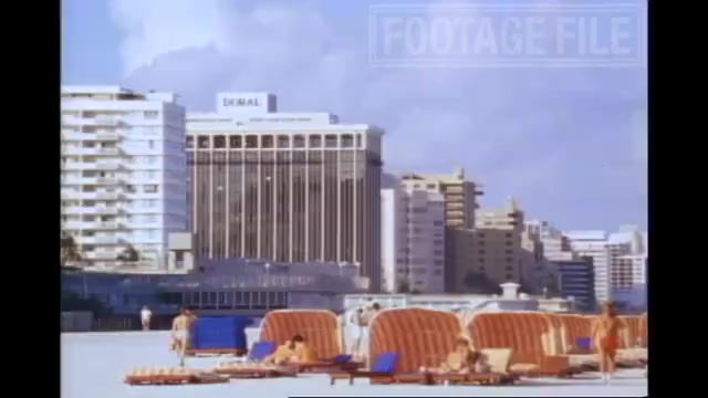Miami Beach 1982 beach, sand, hotels, medium wide shot - Footage File