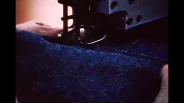San Francisco, 1970's, Rivet machine, putting rivets into blue jeans ...