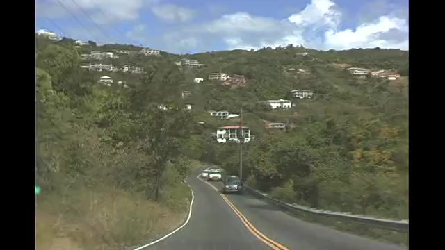 St. Thomas, The Virgin Islands, POV driving on the left, road, trees ...