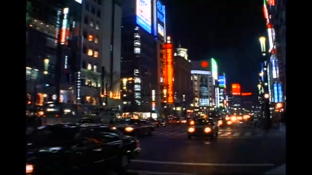 Tokyo, The Ginza District at night, neon lights, wide shot, tilt up ...