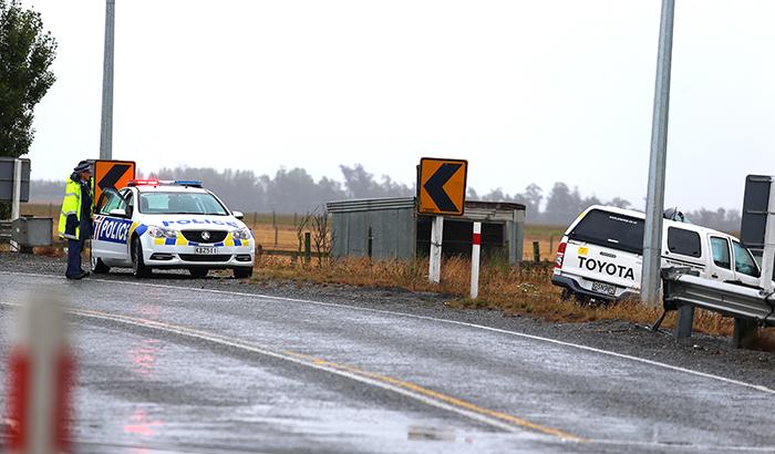 Car, ute crash on crossing